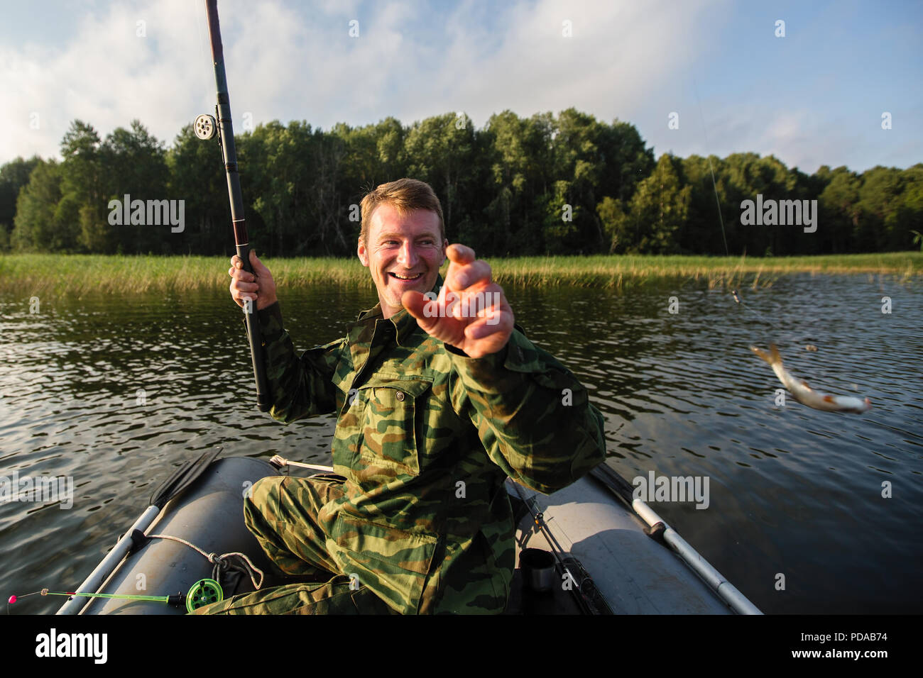 Fisherman catching big fish from boat hi-res stock photography and ...