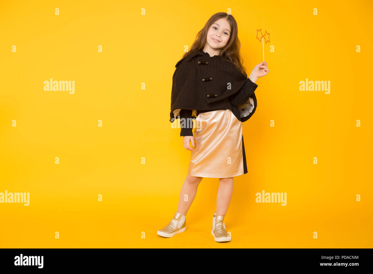 Little girl with toy star Stock Photo - Alamy