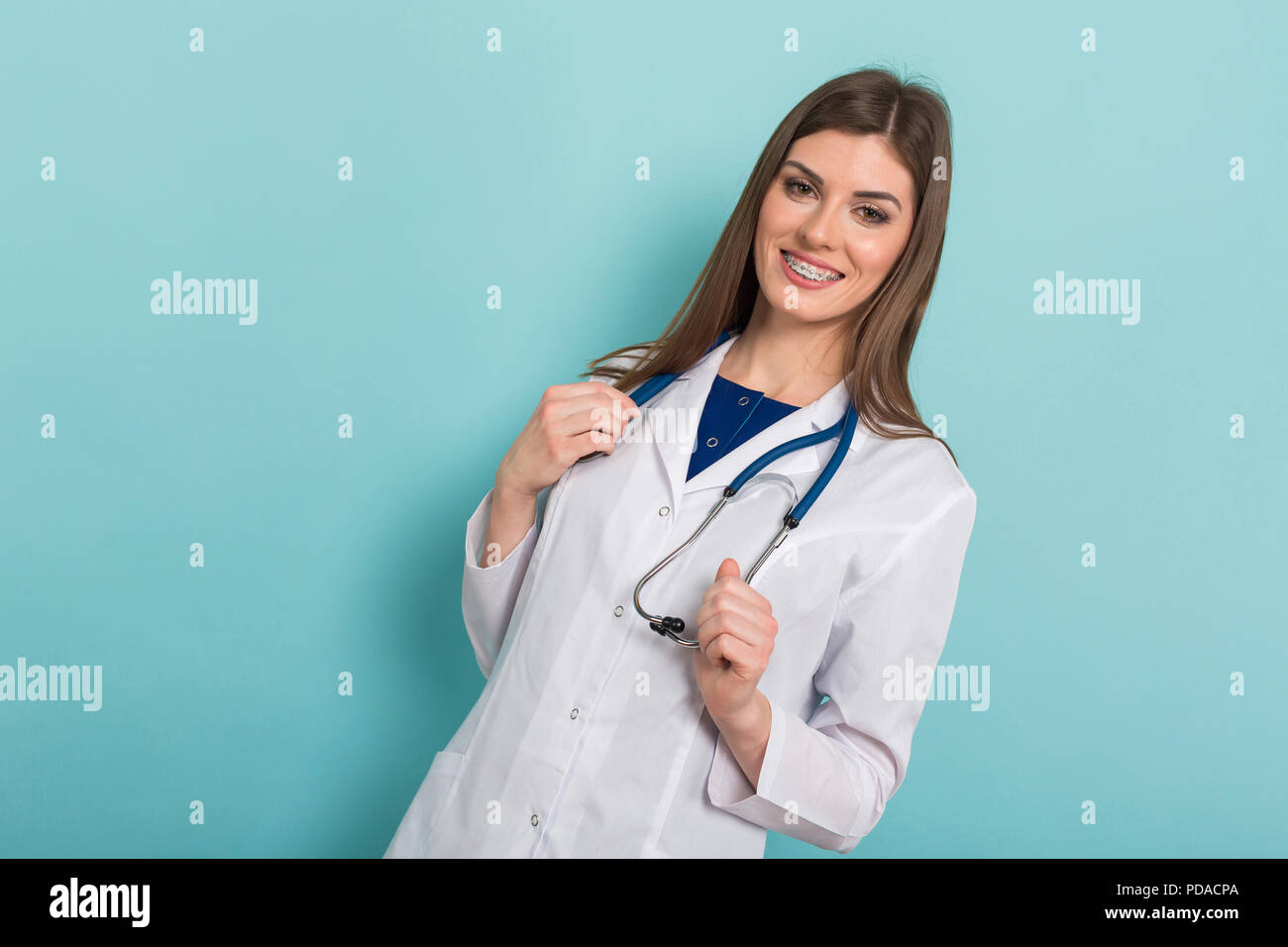 Attractive female doctor in white coat Stock Photo - Alamy