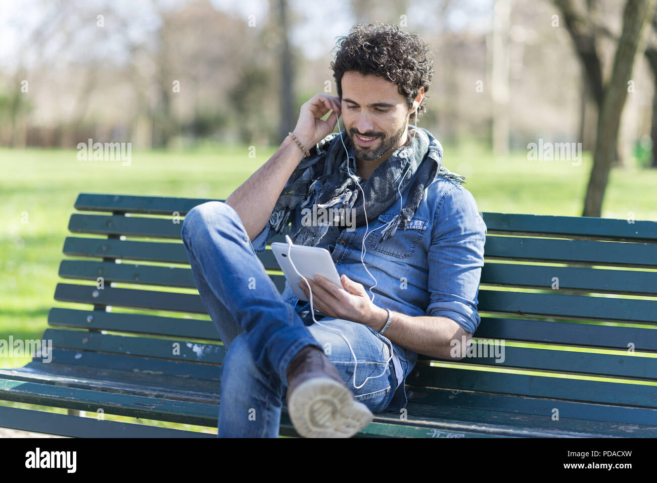 Man listening music outdoors hi-res stock photography and images - Alamy