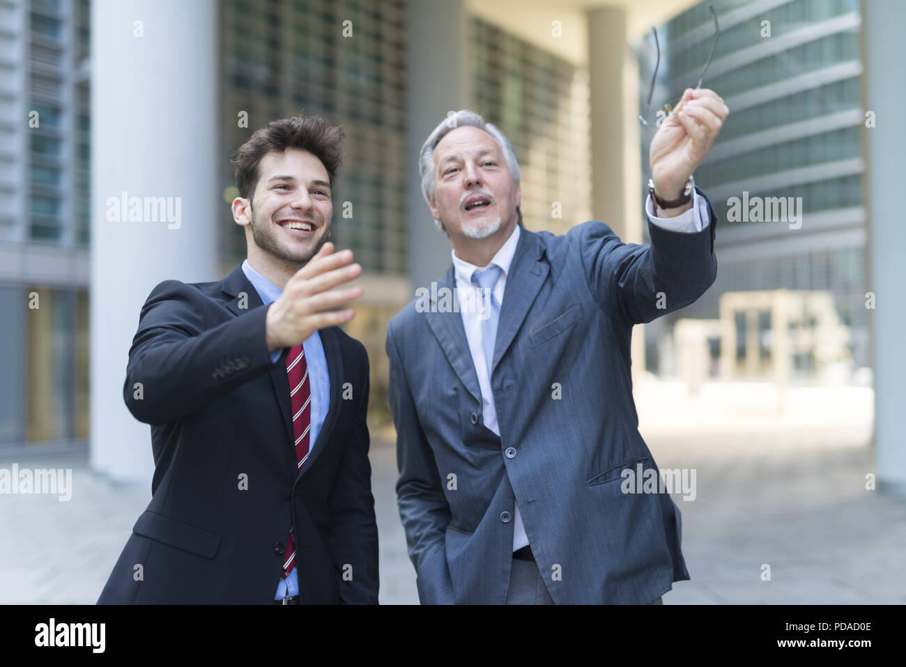Business people calling a colleague Stock Photo - Alamy