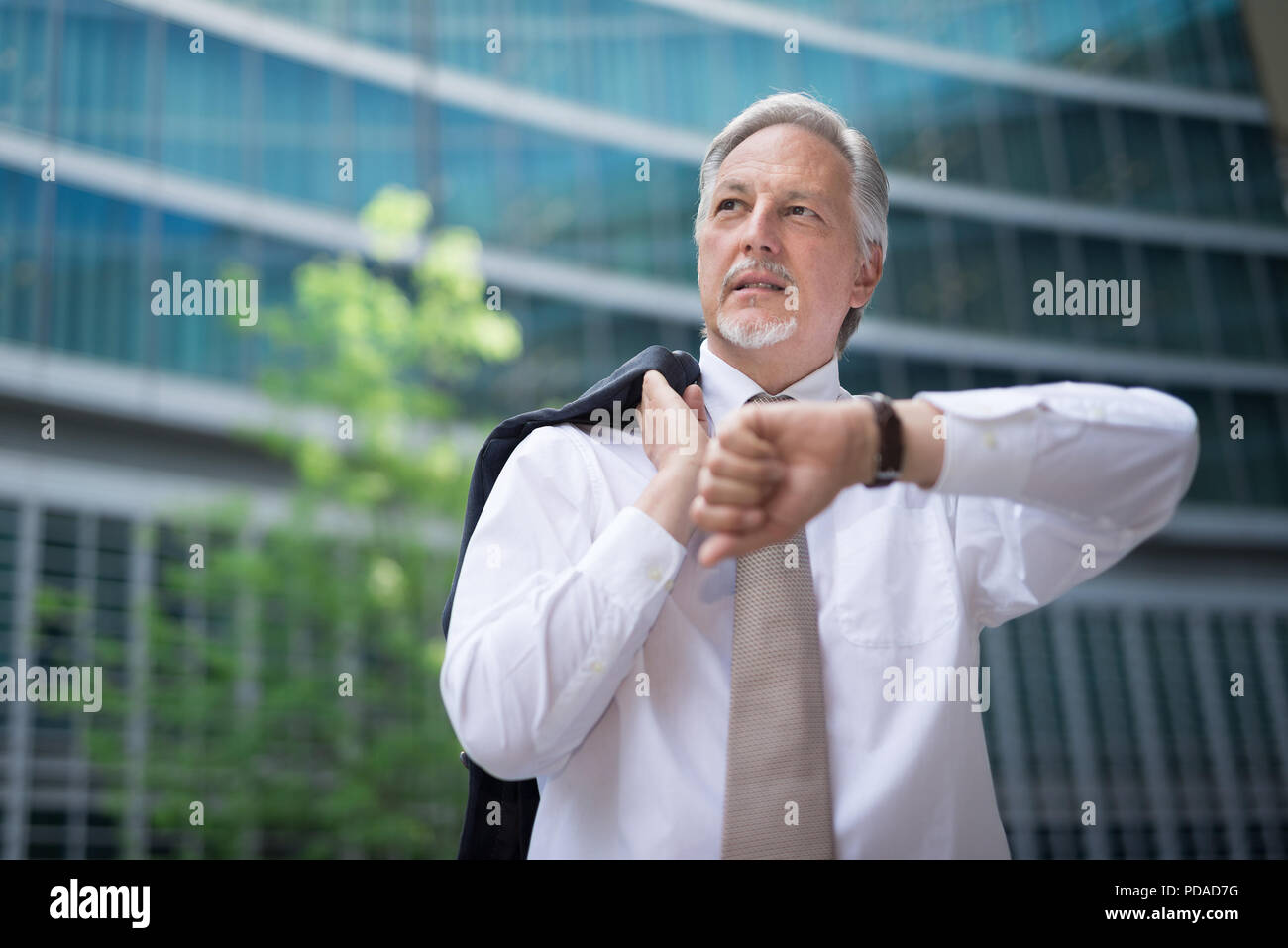 Senior looking at clock hi-res stock photography and images - Alamy