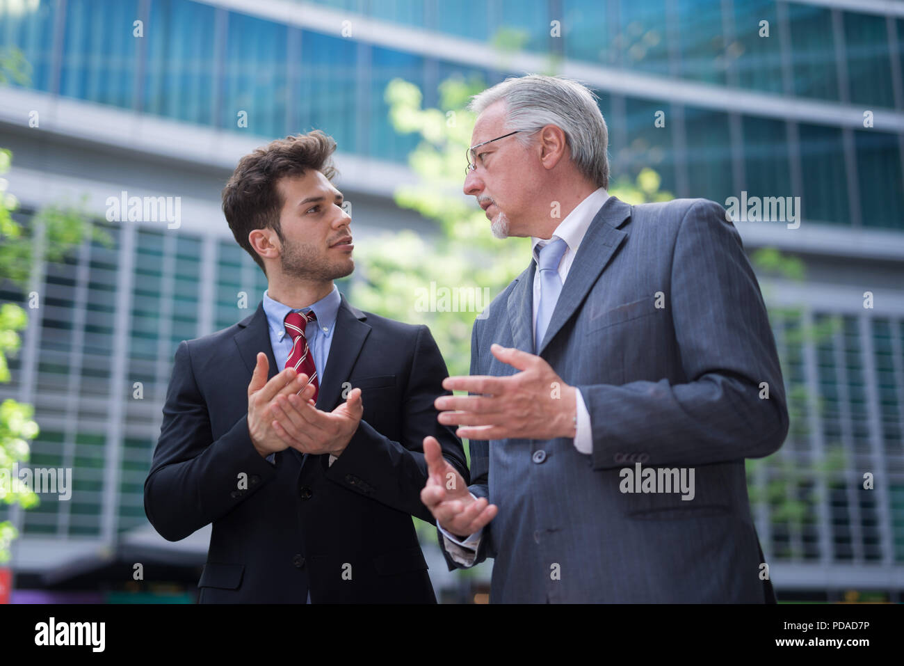 Business people having a conversation Stock Photo - Alamy