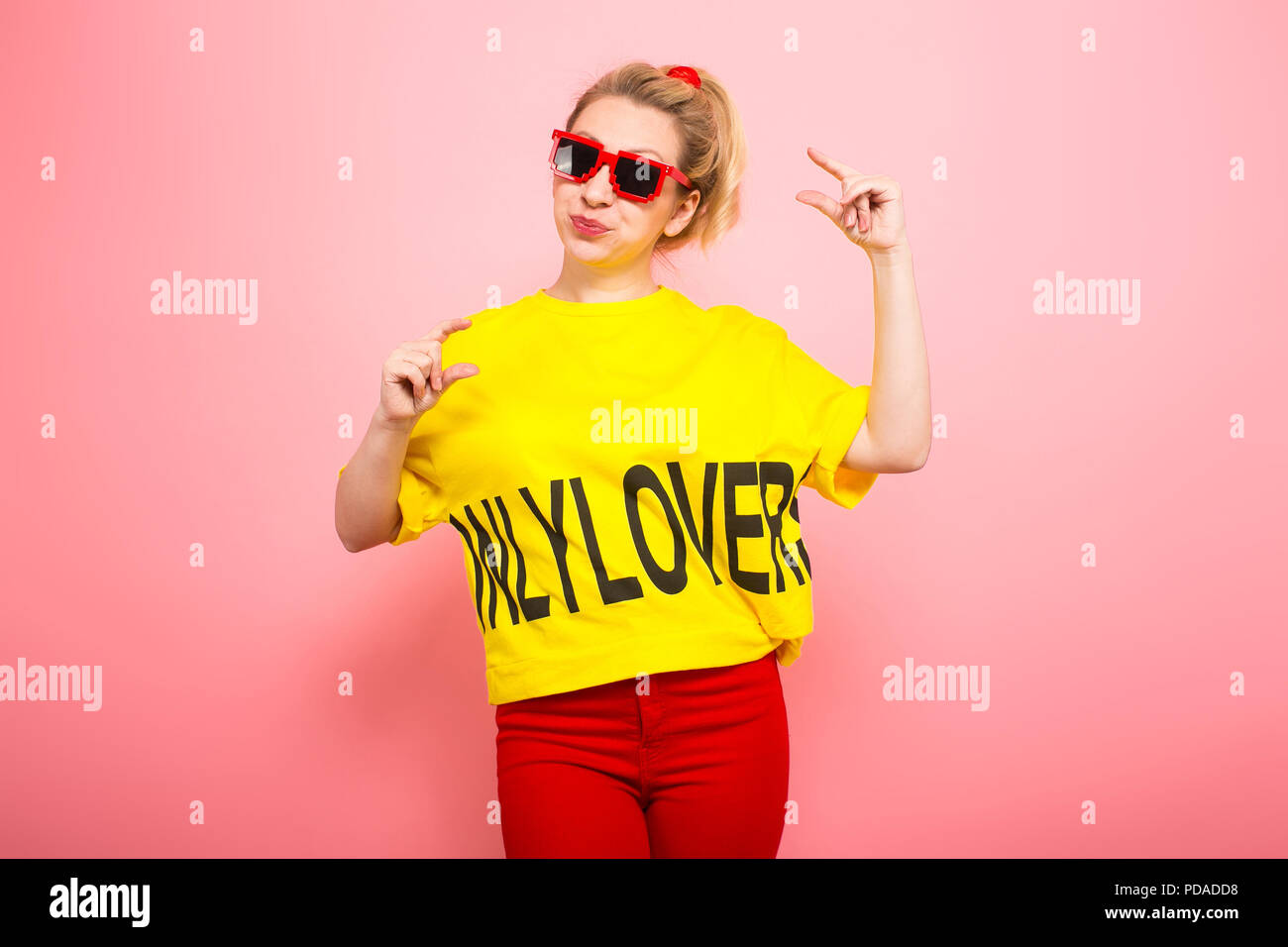 Blonde woman in bright clothes Stock Photo - Alamy