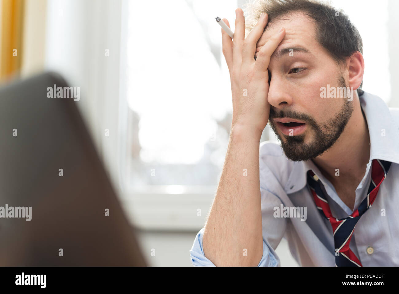 Stressed businessman at work Stock Photo - Alamy