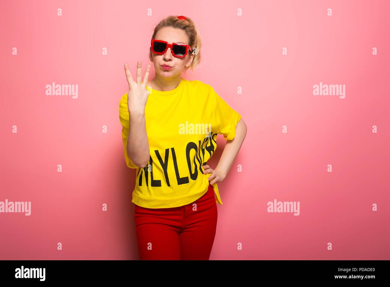 Blonde woman in bright clothes Stock Photo - Alamy