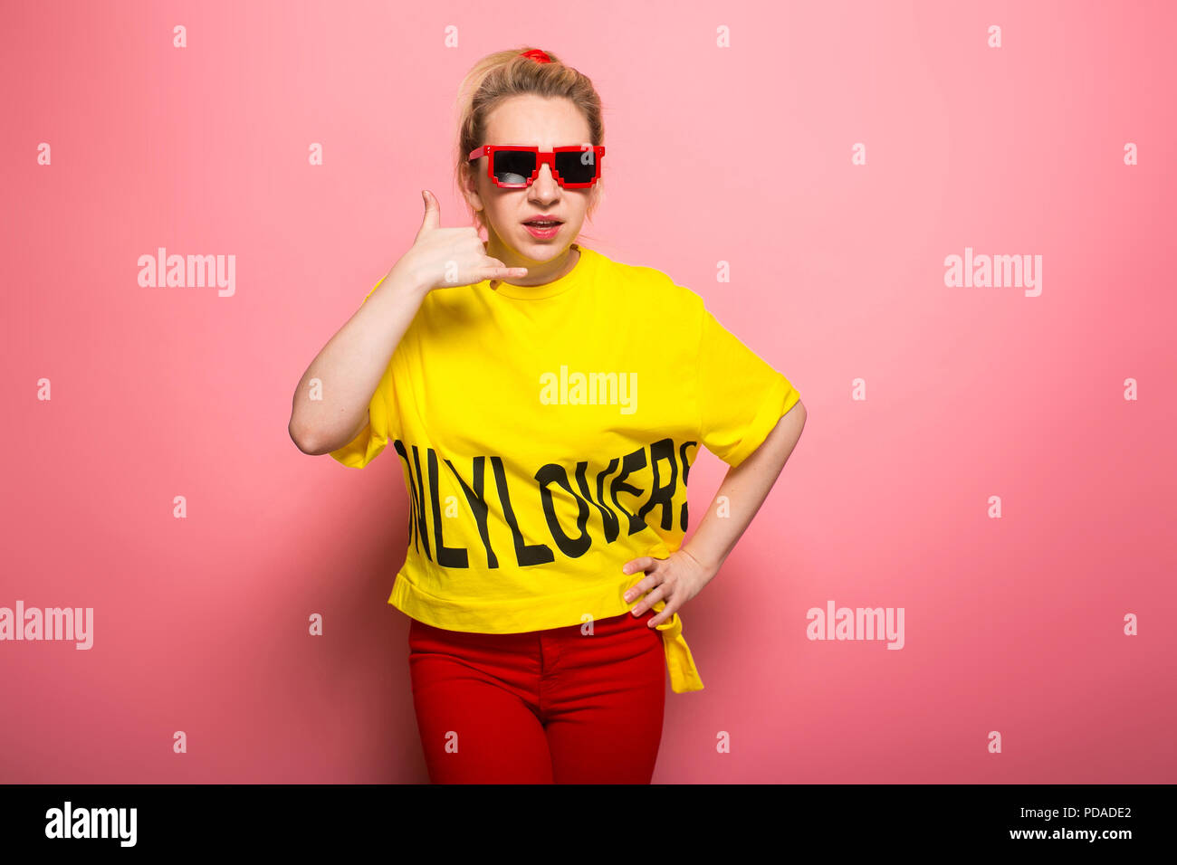 Blonde woman in bright clothes Stock Photo - Alamy