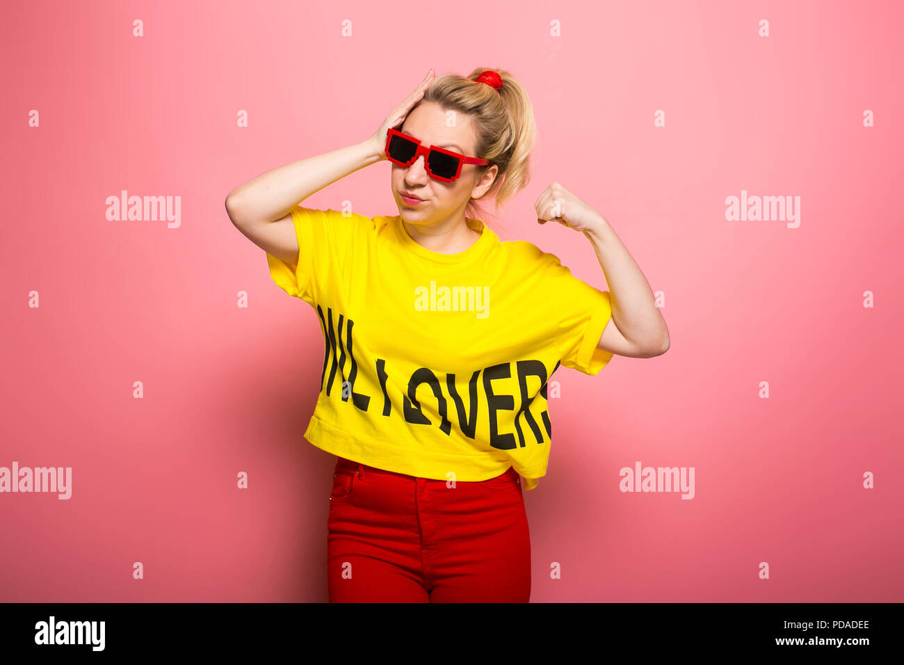 Blonde woman in bright clothes Stock Photo - Alamy