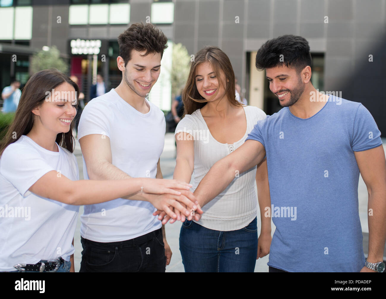 Group of friends putting their hands together, friendship concept Stock ...