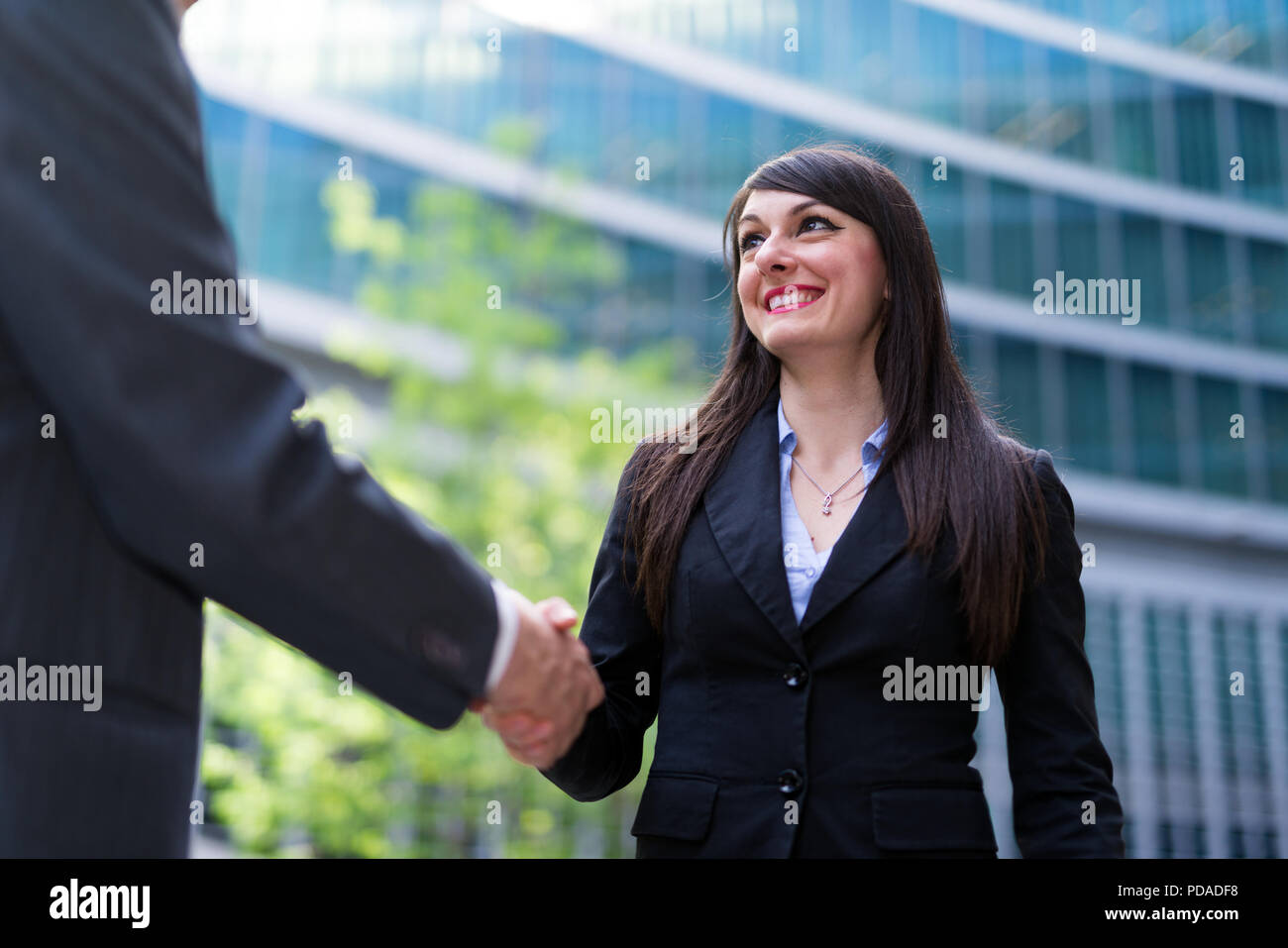 Bank manager and shaking hands hi-res stock photography and images - Alamy