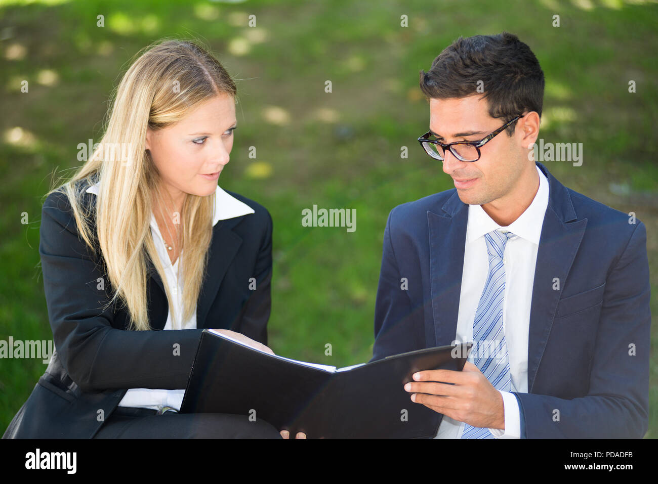 Business people working outdoors Stock Photo - Alamy