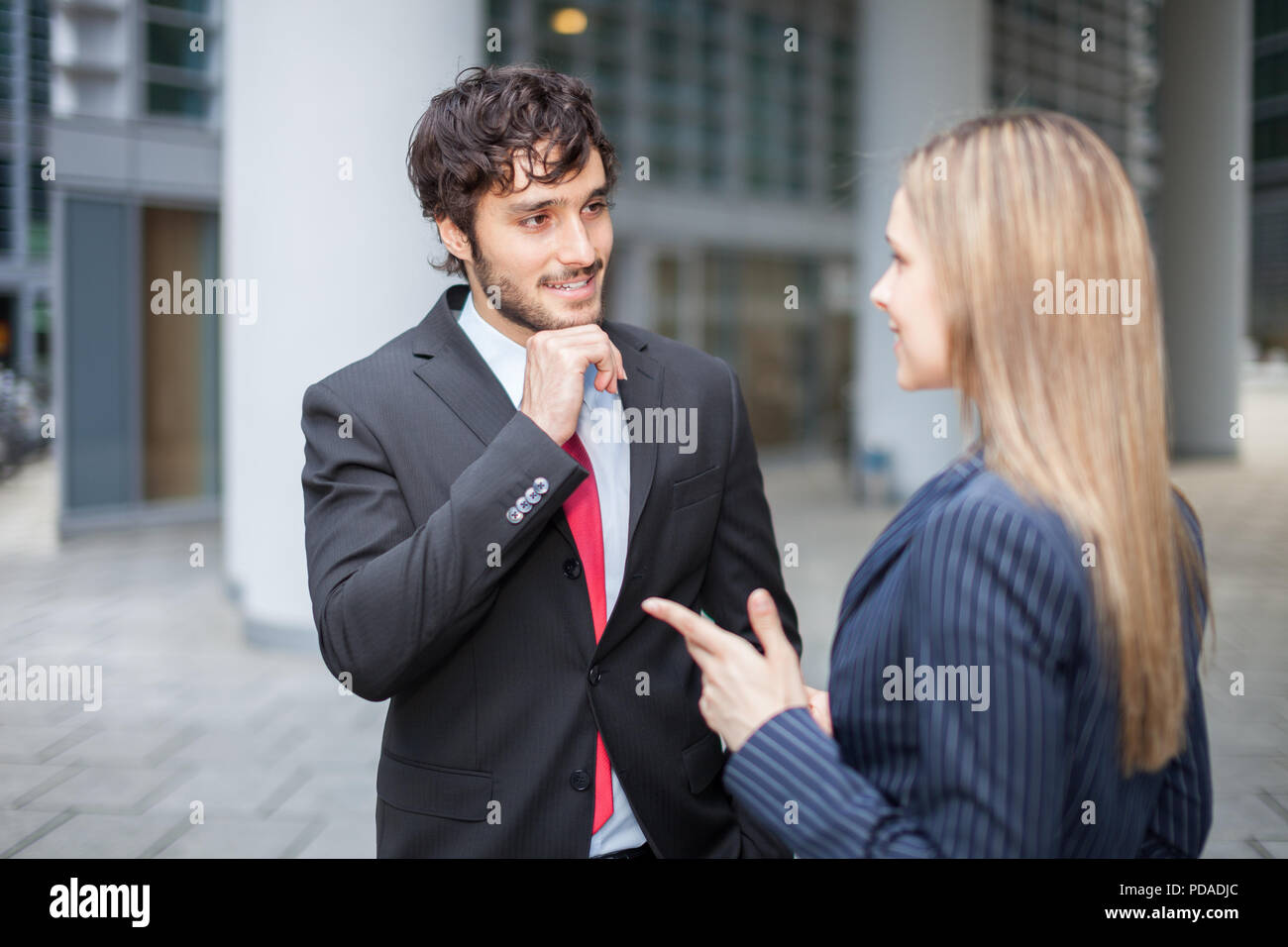 Business people having a conversation Stock Photo - Alamy