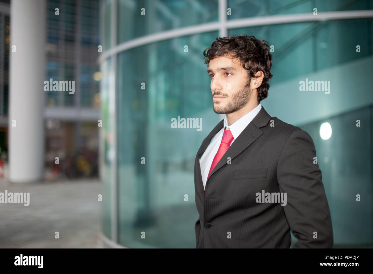 Handsome businessman in front of his office Stock Photo - Alamy