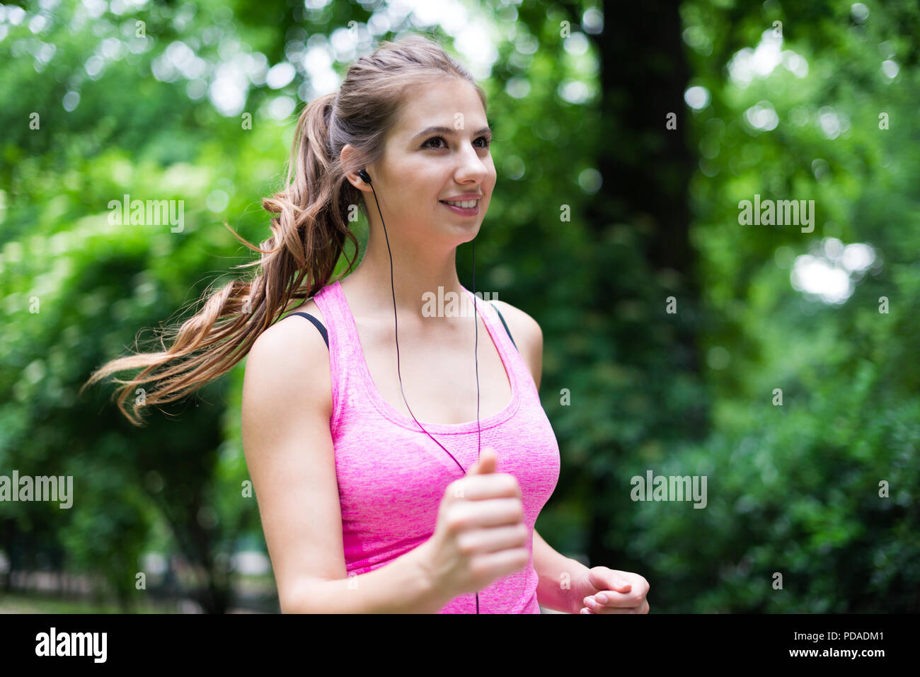 Woman running outdoor Stock Photo - Alamy