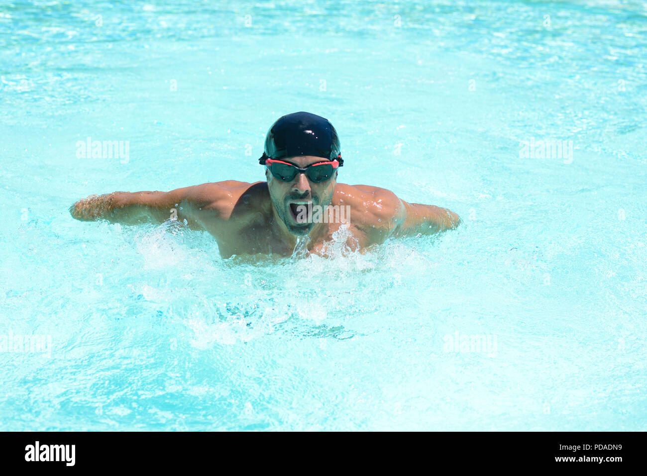 Man swimming in a pool Stock Photo - Alamy