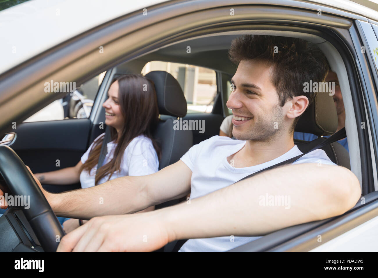 Group of happy friends on a car Stock Photo - Alamy