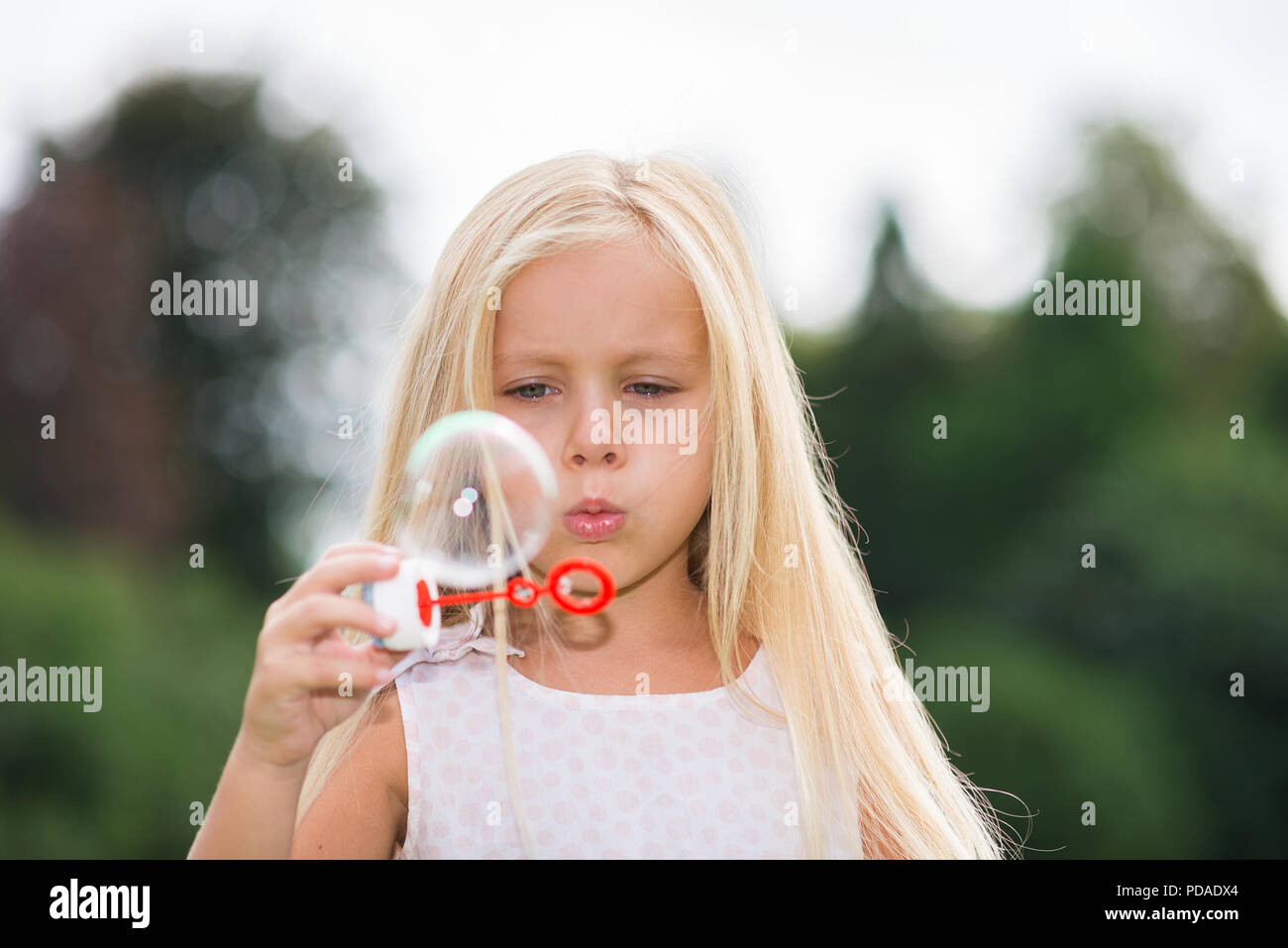 Child making soap bubbles hi-res stock photography and images - Alamy