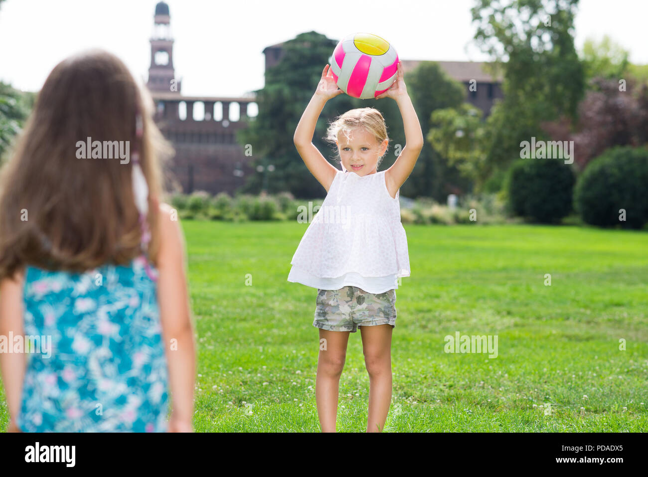 Girls playing with a ball Stock Photo - Alamy