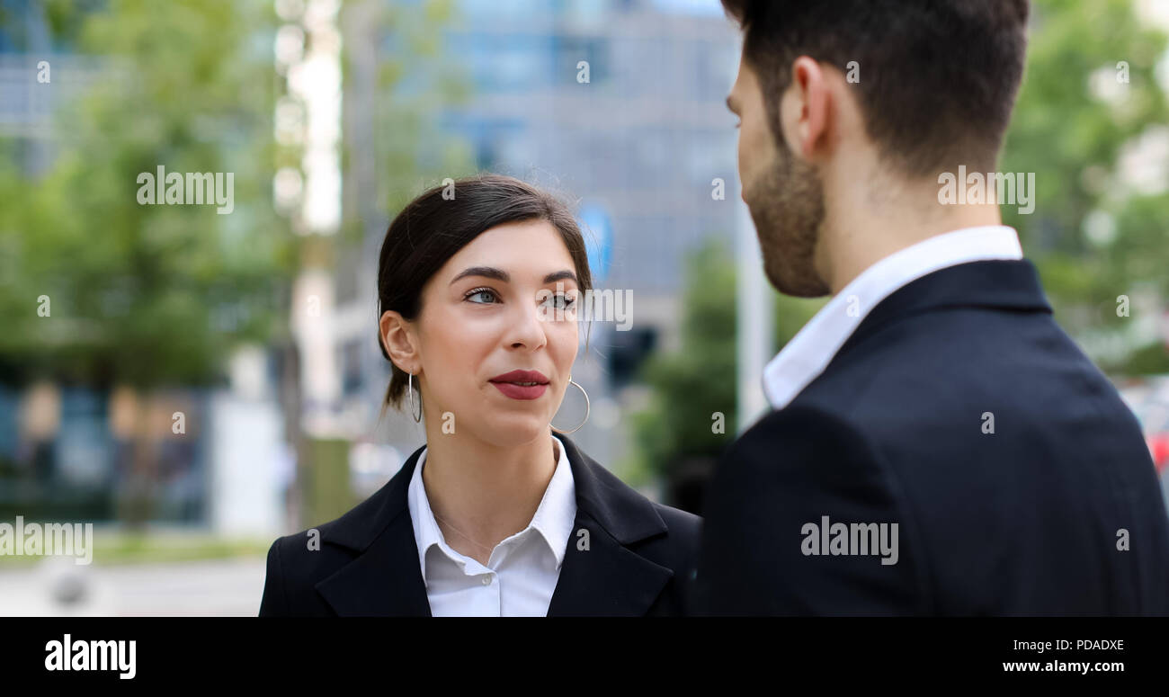 Business partners discussing together outdoor hi-res stock photography ...