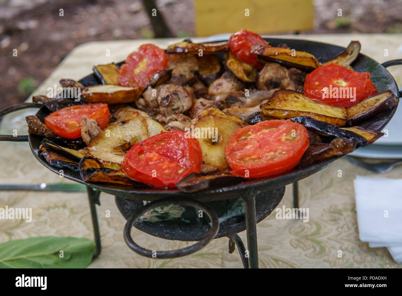Saj kebap with mushrooms chicken. Outdoor picnic table Stock Photo - Alamy