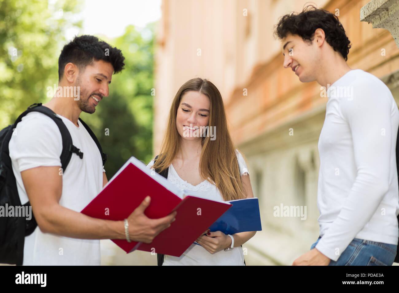Three friends in the courtyard hi-res stock photography and images - Alamy