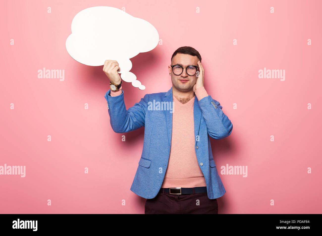Handsome man in bright jacket with speech bubble Stock Photo - Alamy