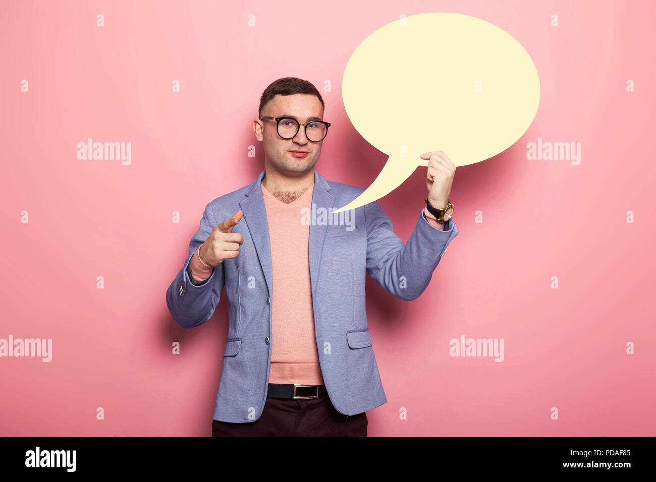 Handsome man in bright jacket with speech bubble Stock Photo - Alamy