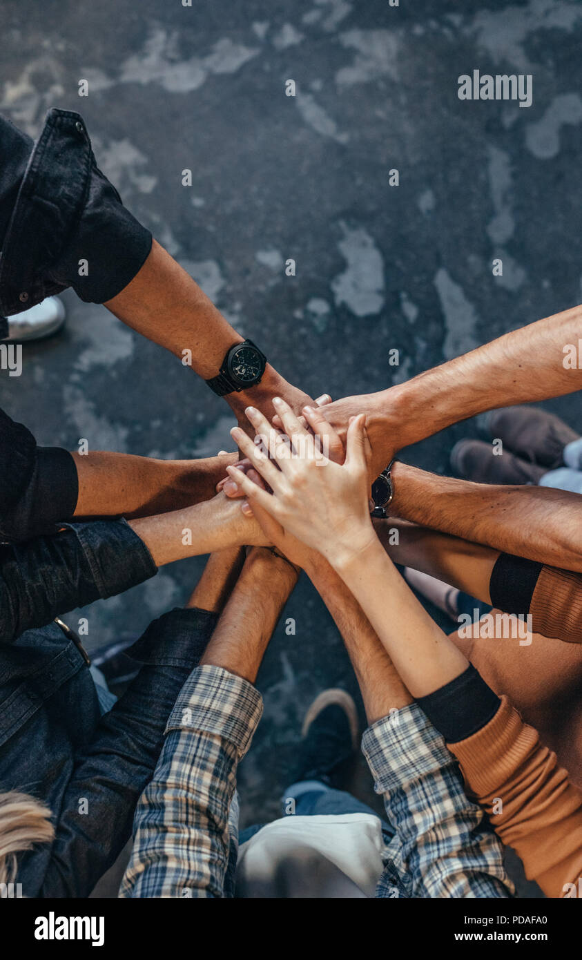 Stack of hands overhead view hi-res stock photography and images - Alamy