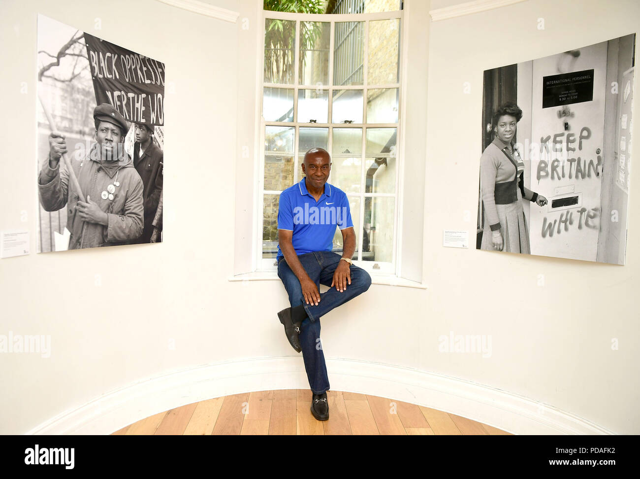 Neil Kenlock between his photographs of Mackie Mackie and Barbara Grey ...