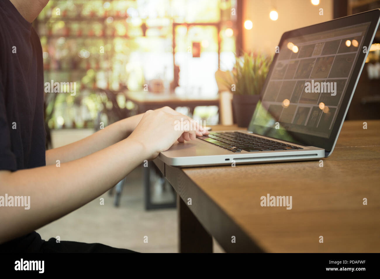 Young business people working with computer in cafe with sunlight Stock ...