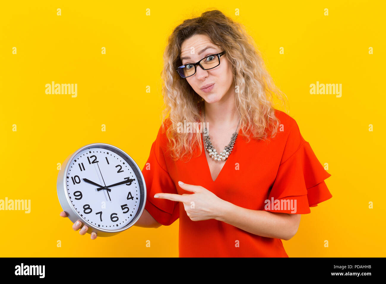 Woman in dress with clocks Stock Photo - Alamy
