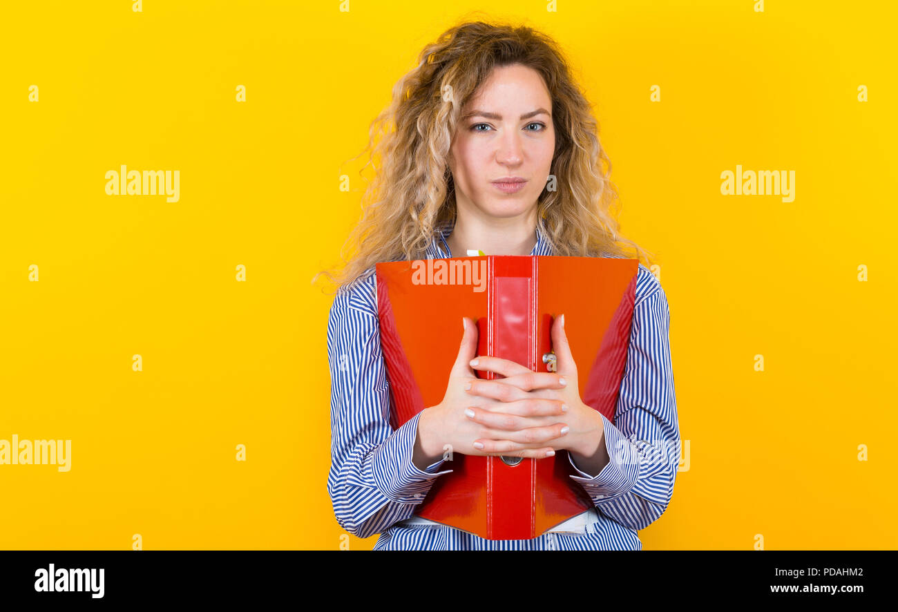 Woman in shirt with big folder Stock Photo - Alamy