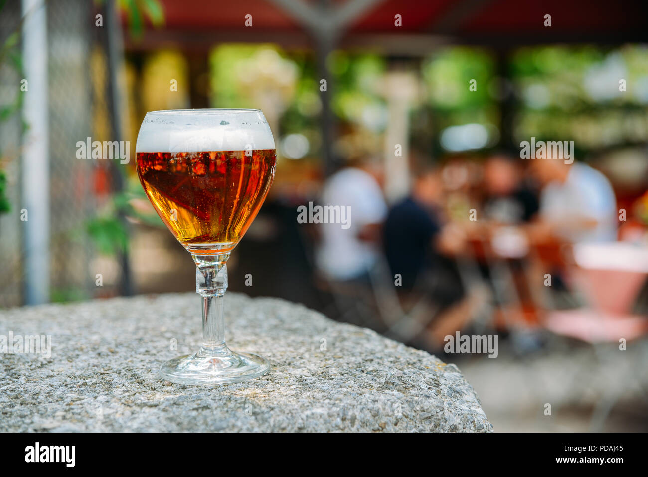 Cold beer glass on at beer garden Stock Photo - Alamy