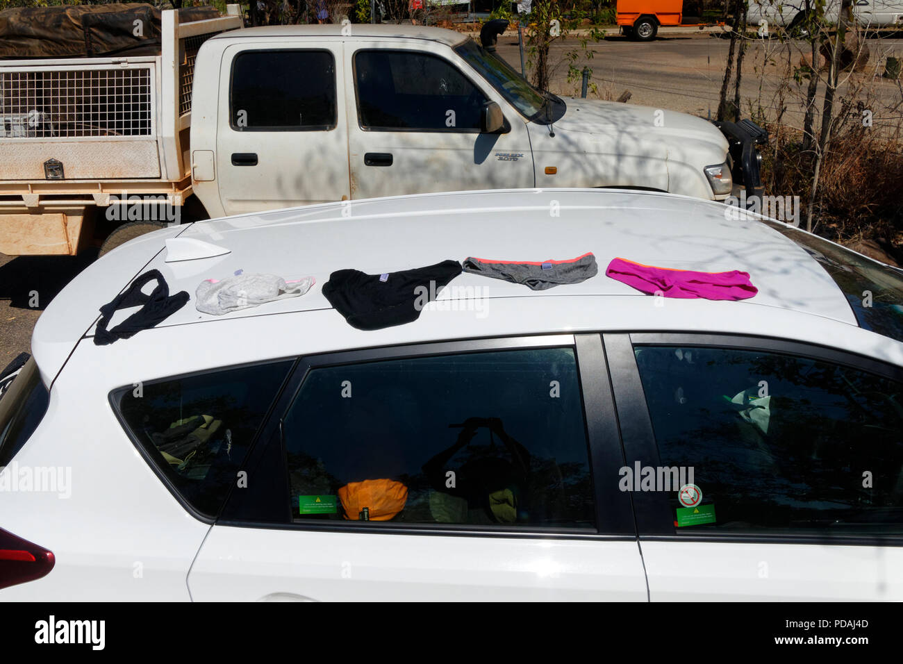 Clothes washing placed on car to dry, Northern Territory, Australia ...
