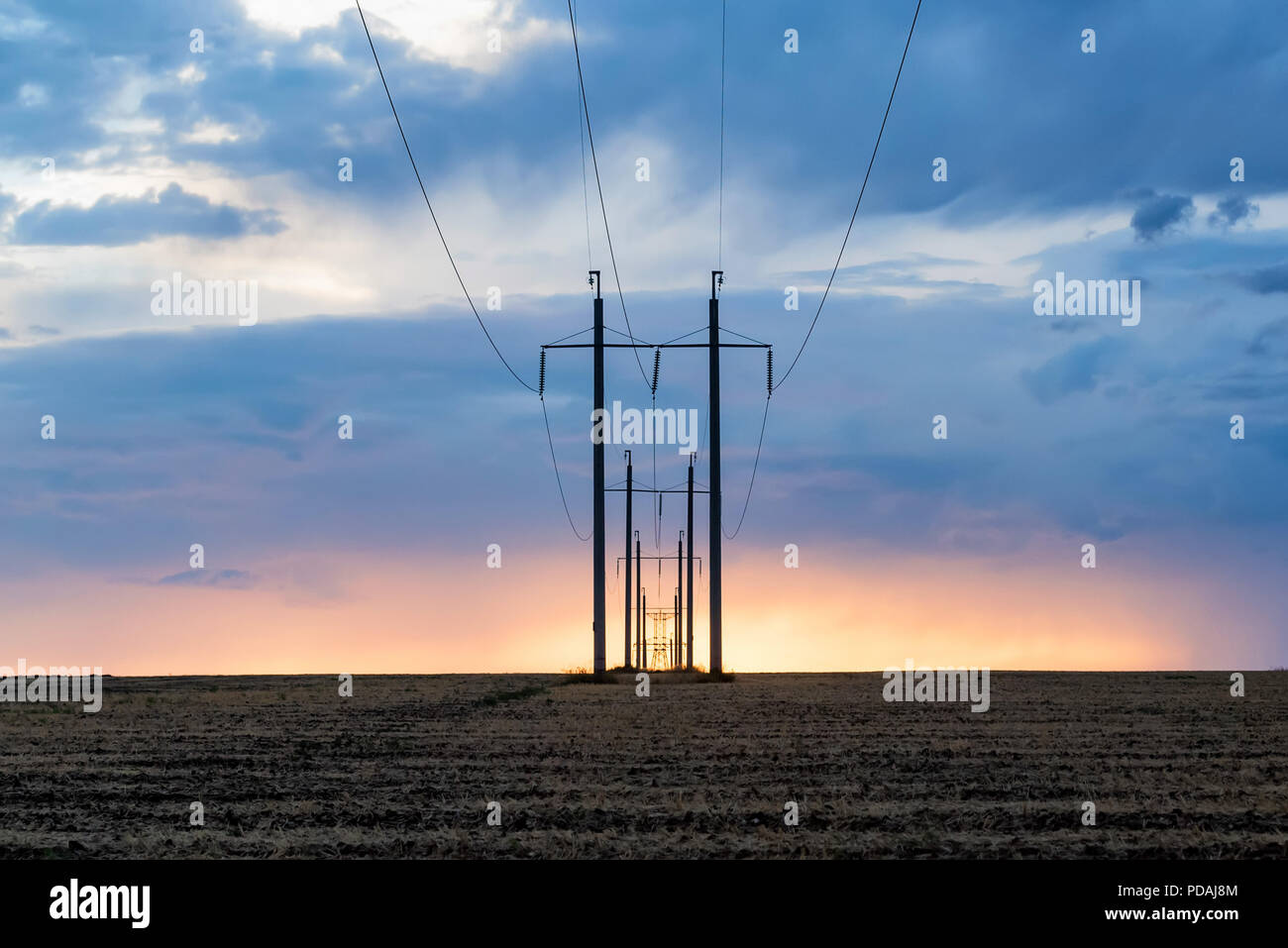 Rural landscape with power poles at sunrise Stock Photo - Alamy