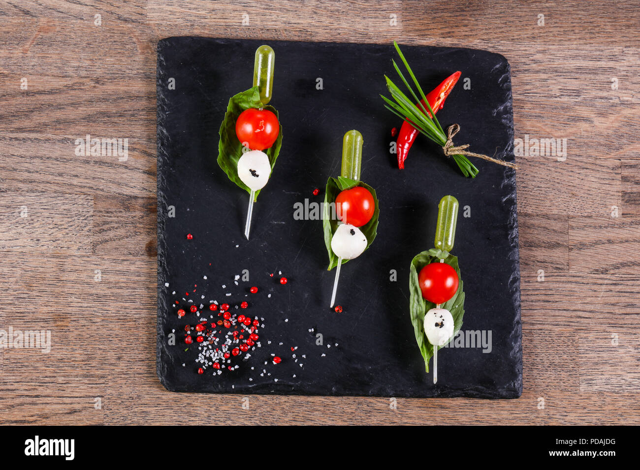 Canape caprese with olive oil Stock Photo - Alamy