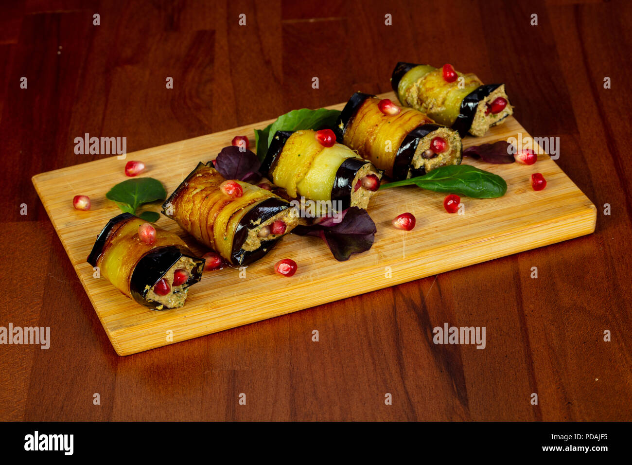 Eggplant roll with nuts and cheese Stock Photo - Alamy