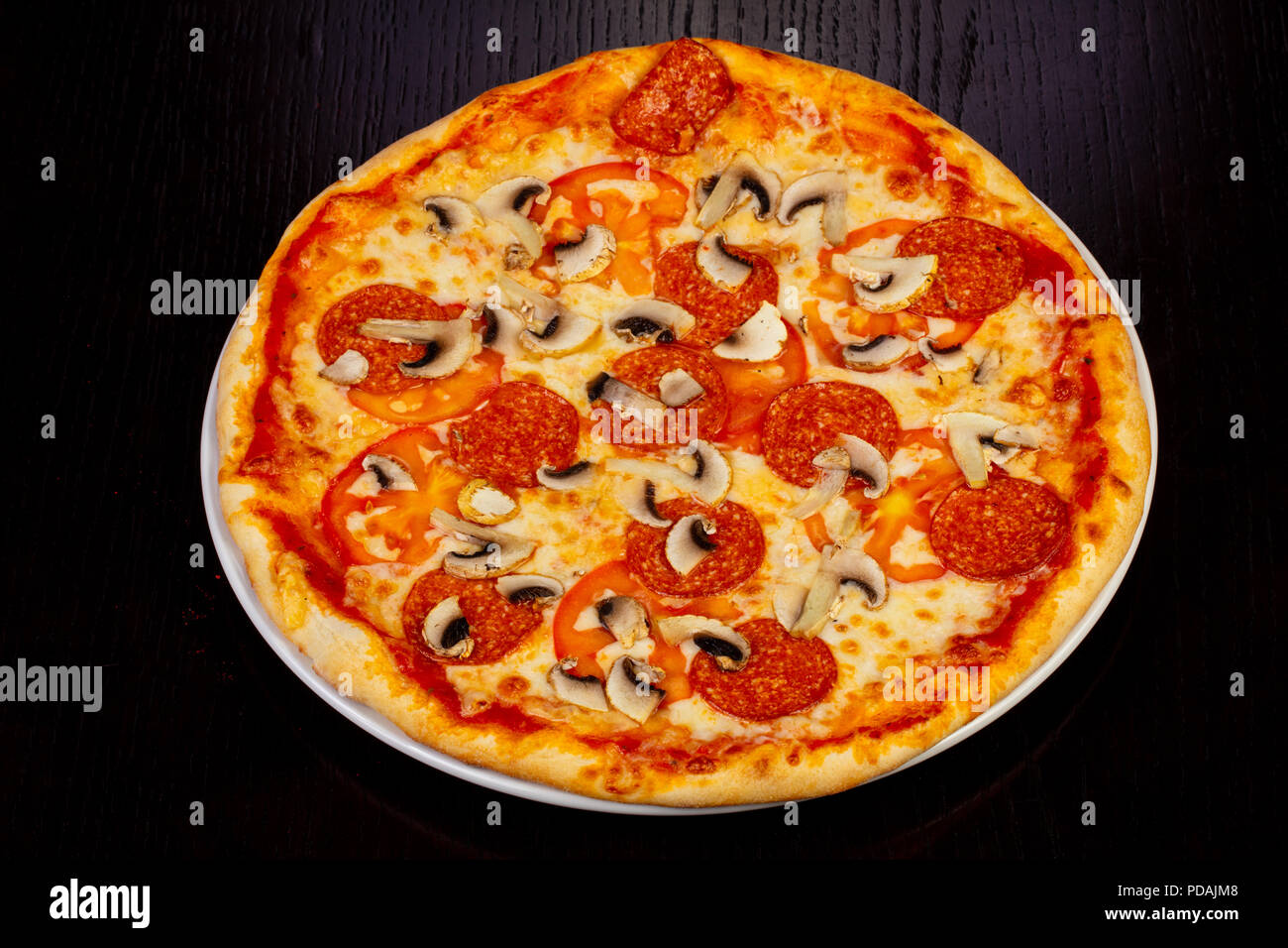 Delicious pepperoni pizza with mushrooms Stock Photo - Alamy