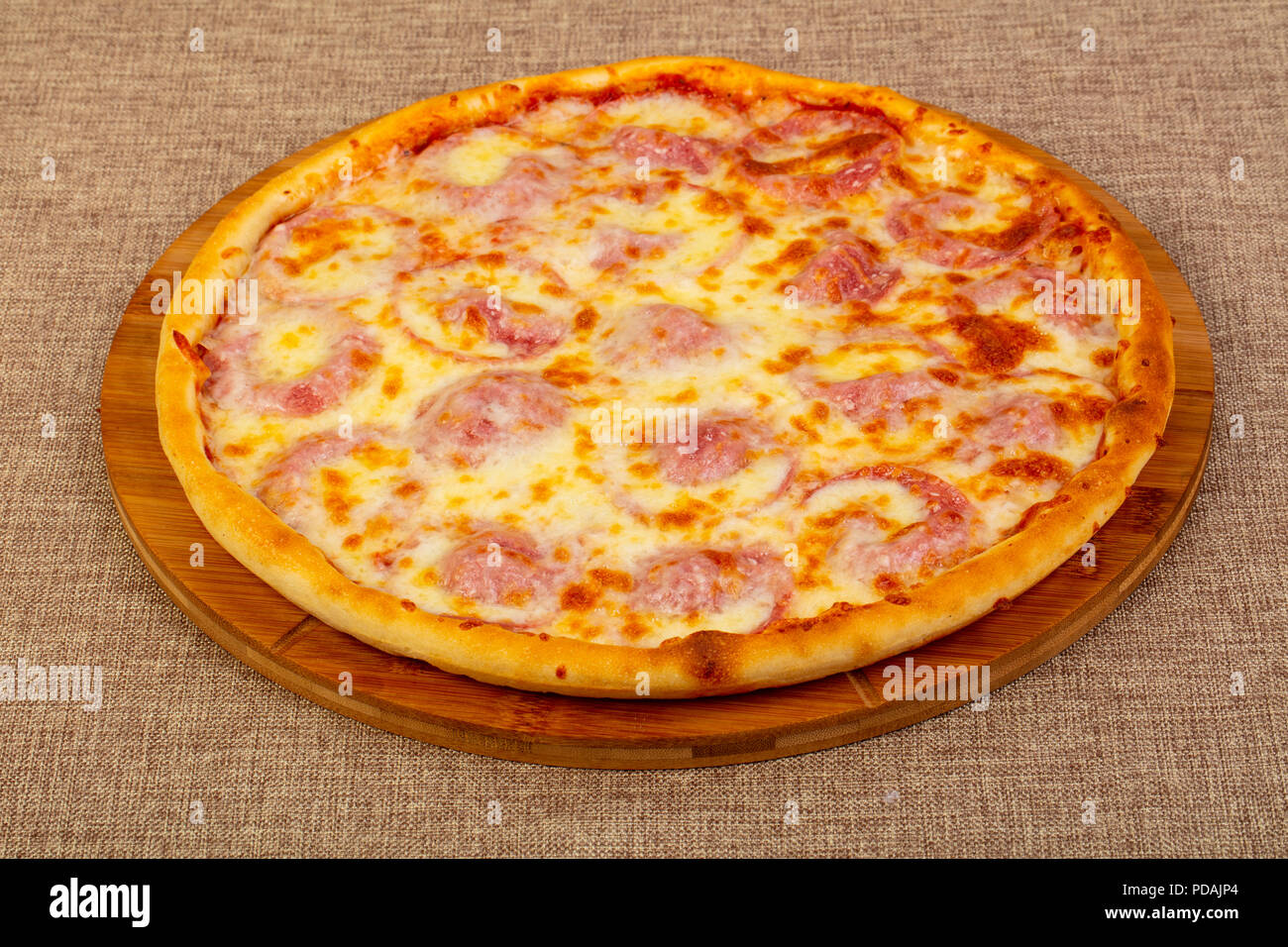 Pizza with ham and cheese Stock Photo - Alamy