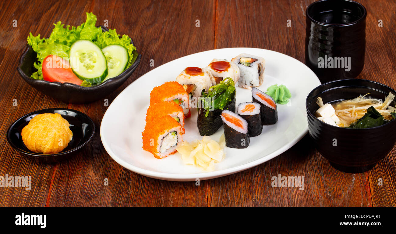 Japanese sushi and roll set with salad and miso soup Stock Photo - Alamy