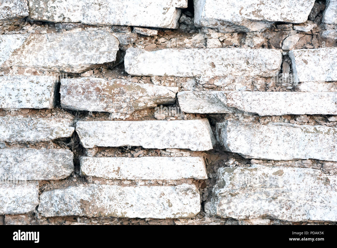 Old stacked tile wall with white wash paint in an old worn state Stock ...