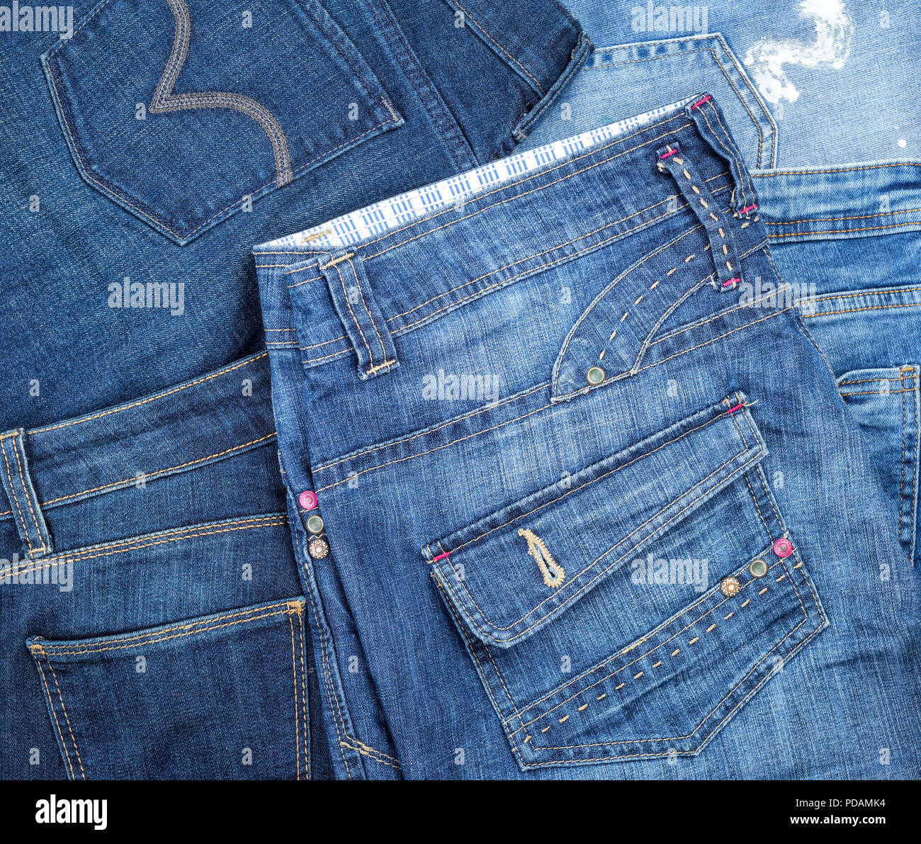 different classic blue jeans, full frame Stock Photo - Alamy