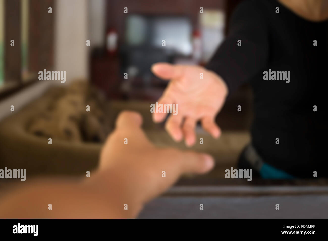 Hand reaching out blurred hi-res stock photography and images - Alamy