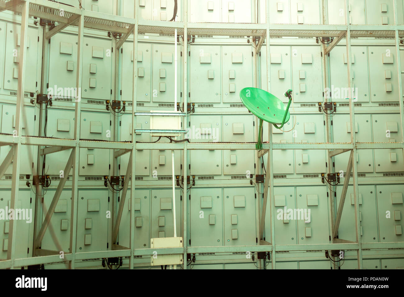 Green color satelite is attached to control panel wall sytem Stock ...