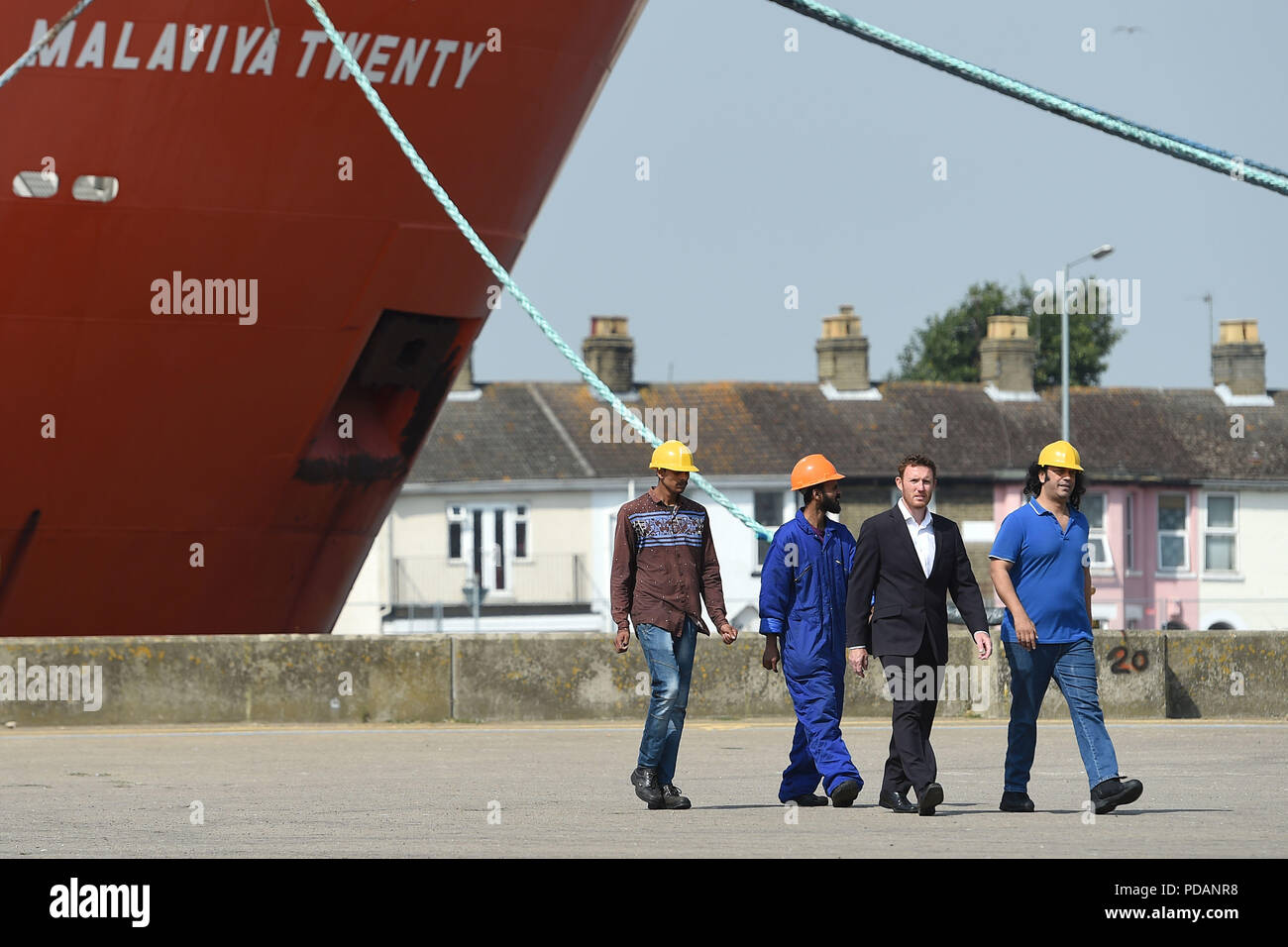 Captain Nikesh Rastogi (right) and his crew speak to Paul Haworth ...