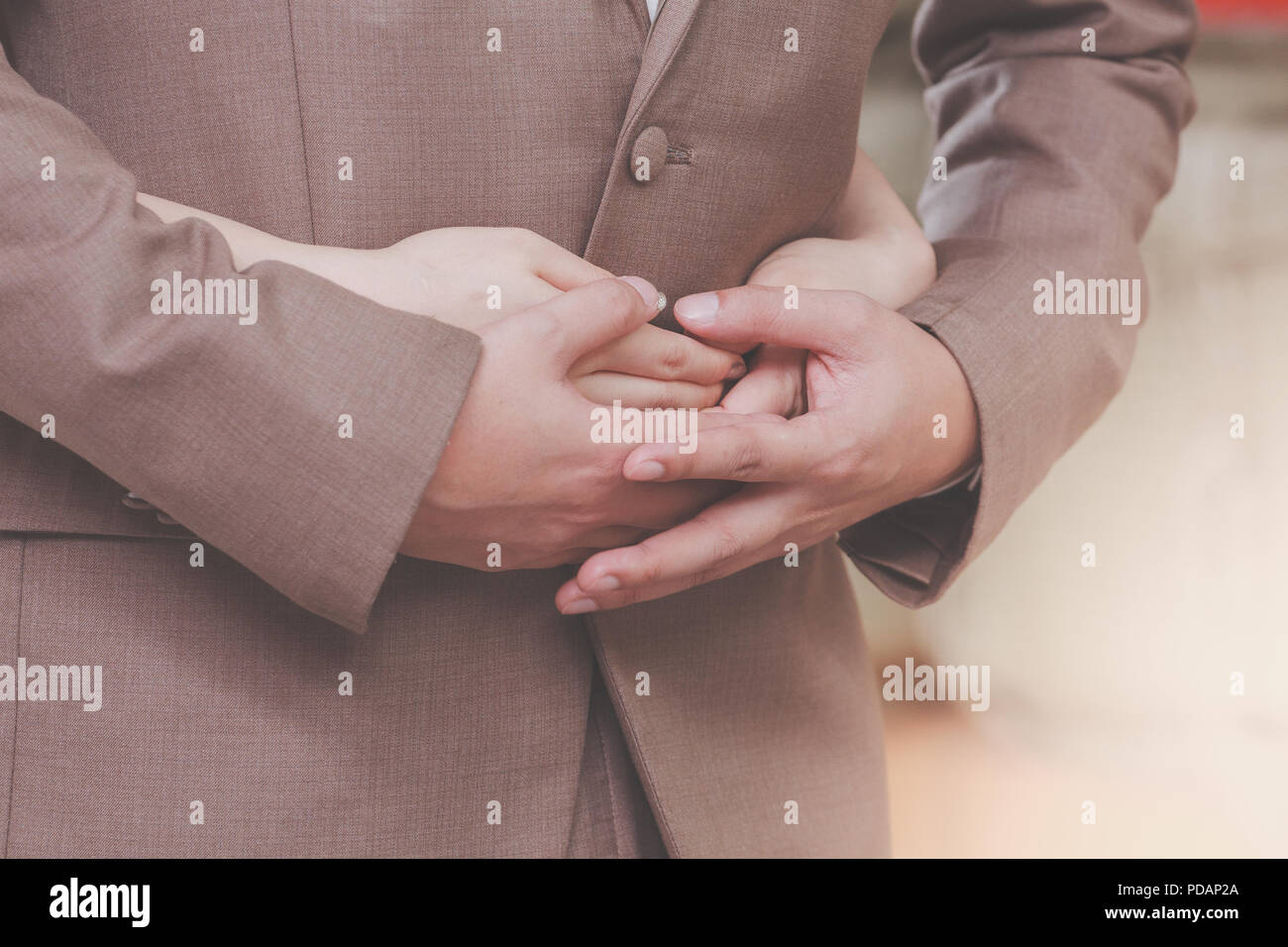 Young express love with a handshake as a symbol of love and marriage ...