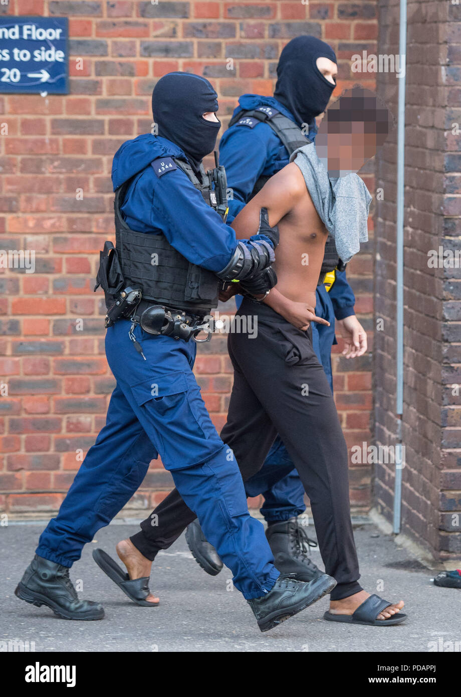 Police officers arrest a man at an address in peckham hi-res stock ...