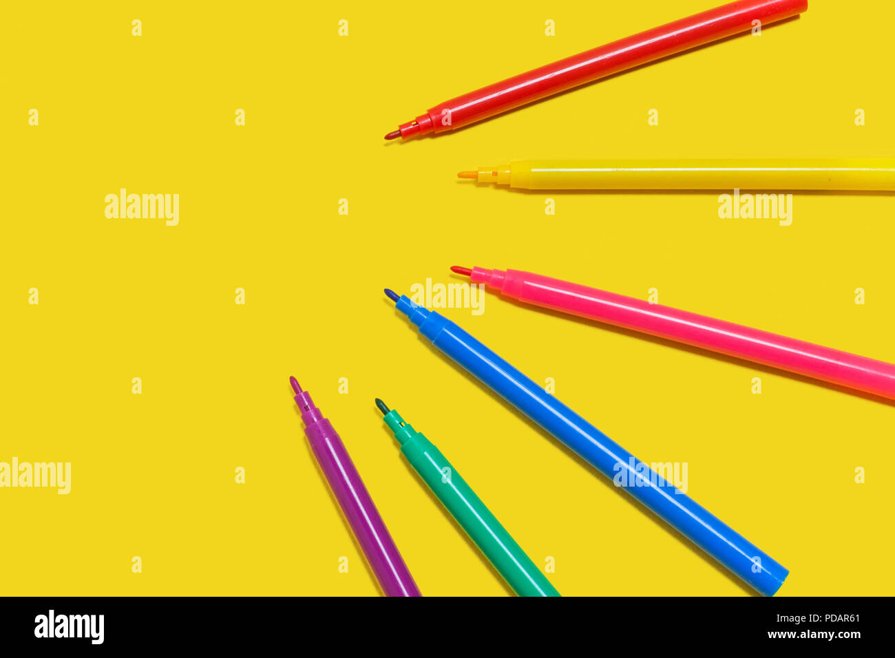 set of colored felt pens on a yellow surface Stock Photo - Alamy