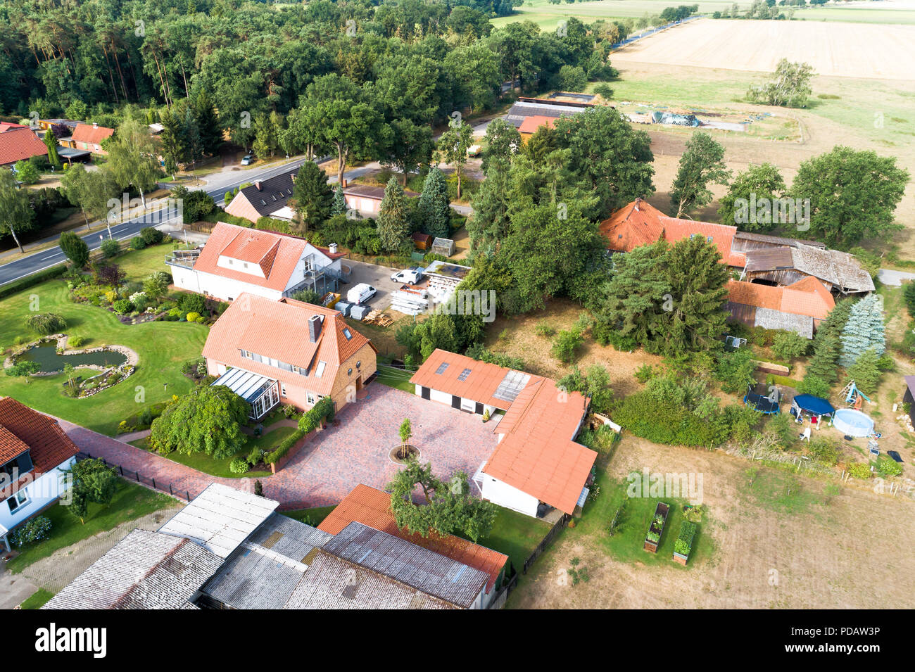 Houses and stables in a village suburb of Wolfsburg, Germany, aerial ...