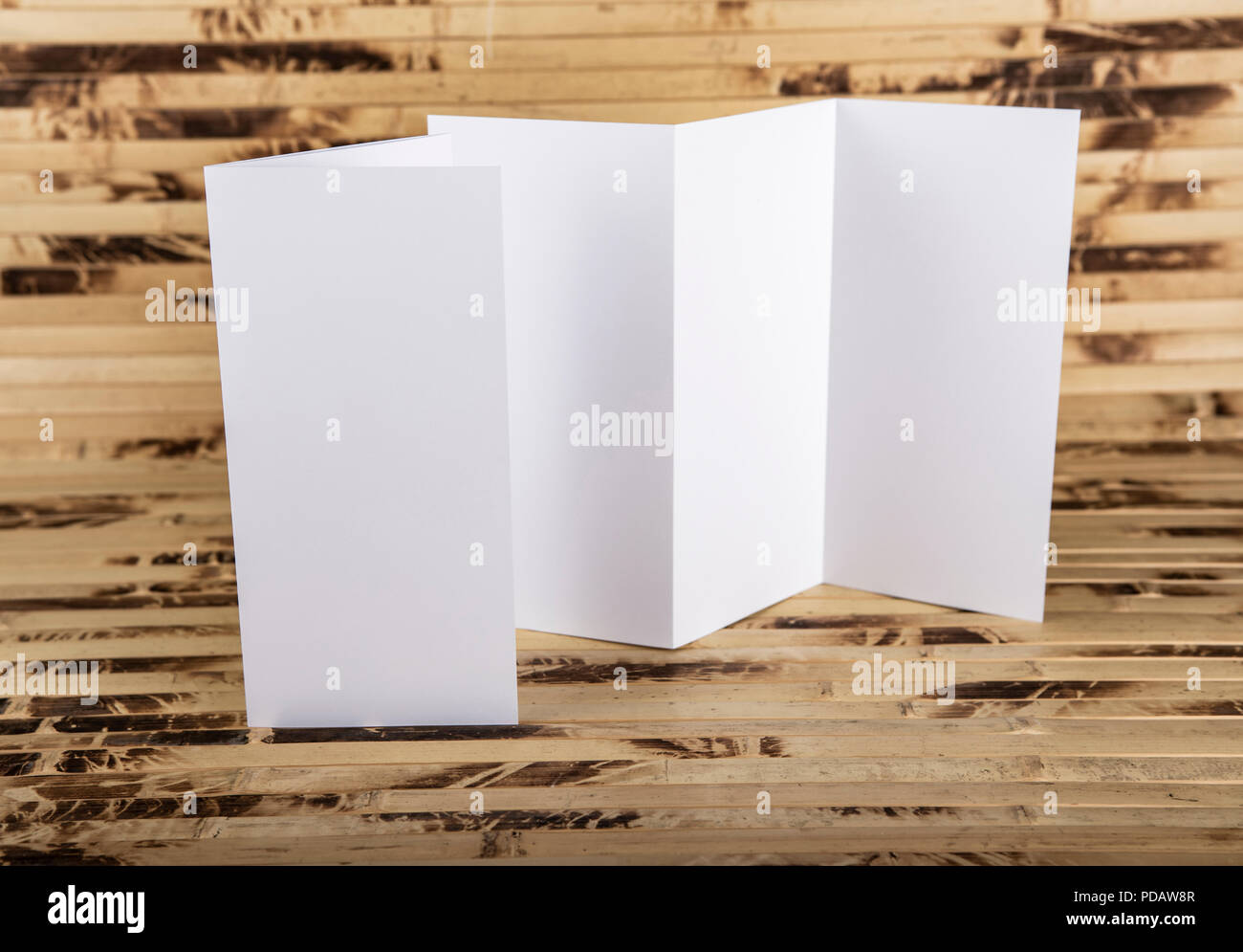 Mockup of white booklet on bamboo background Stock Photo - Alamy
